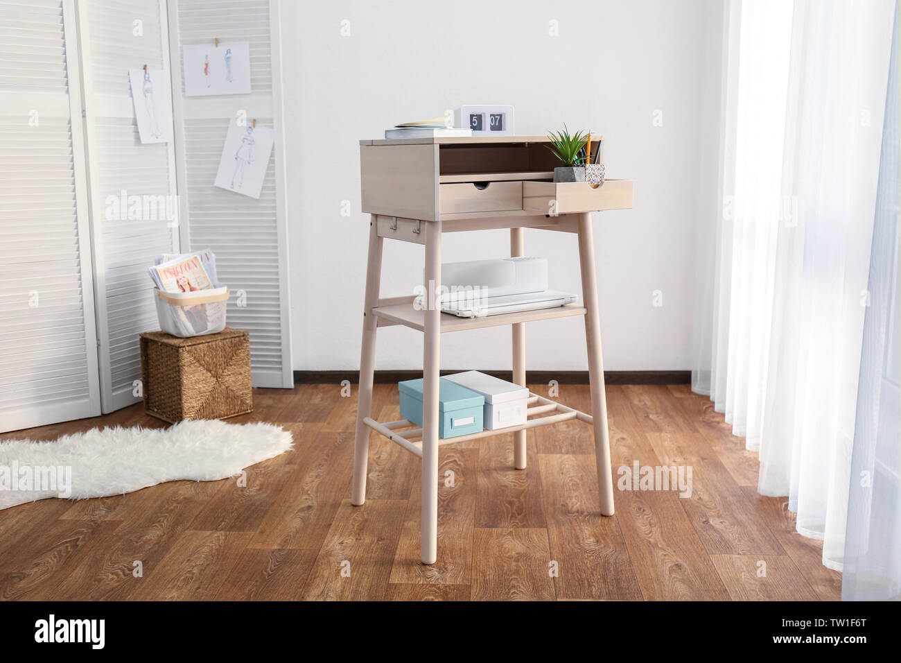 High wooden table as stand up work place in modern interior Stock Photo ...
