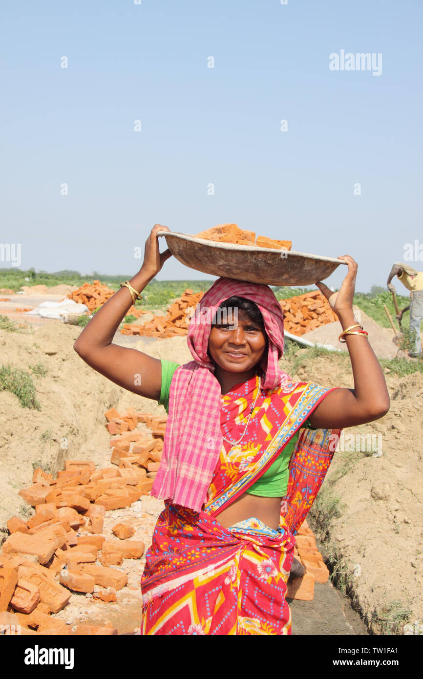 Construction worker carrying bricks hi-res stock photography and images ...