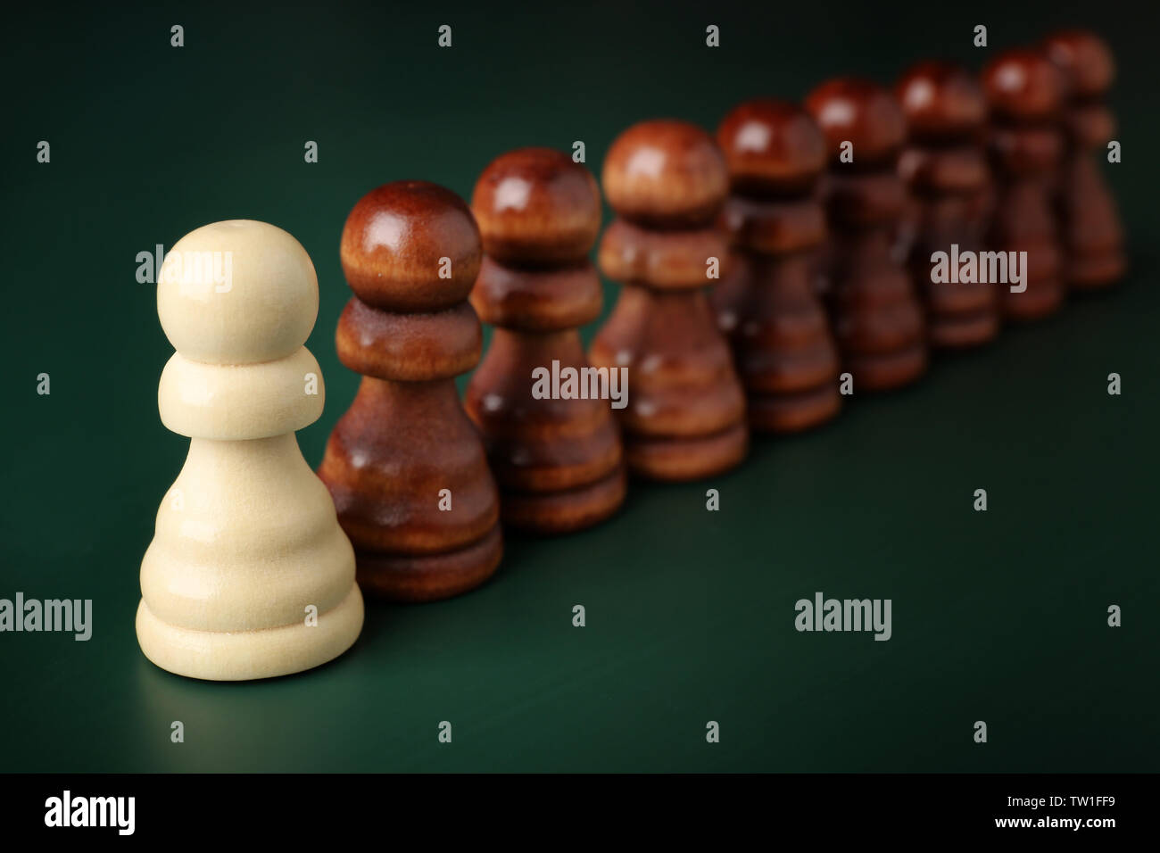 Boss vs Leader concept. Chess pieces on green background Stock Photo ...