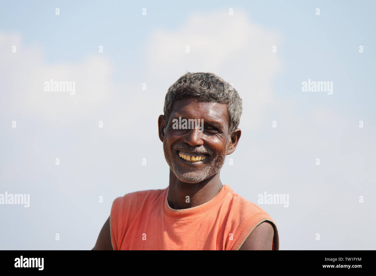 Portrait of a man smiling, India Stock Photo - Alamy