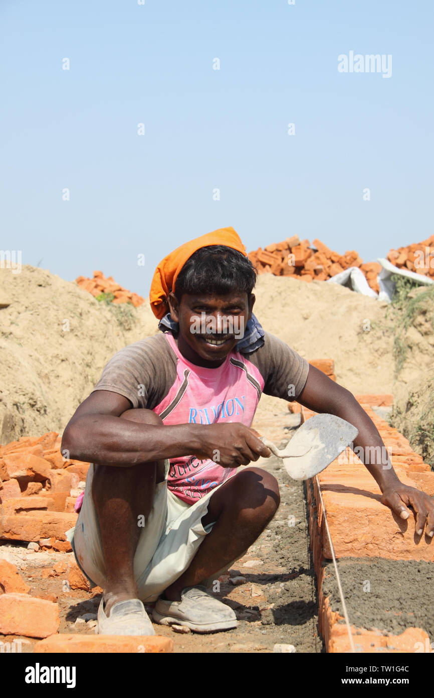 Mason working at a construction site, India Stock Photo - Alamy
