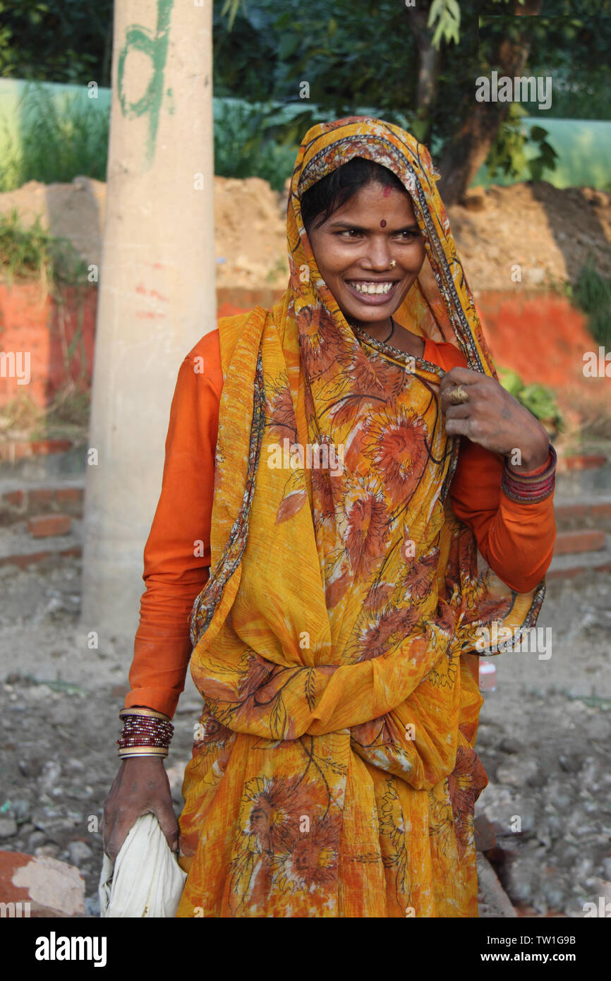Rural woman standing and smiling Stock Photo - Alamy
