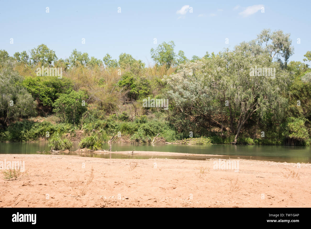 Daly River scene with native bushland, sandy shore and blue skies in ...