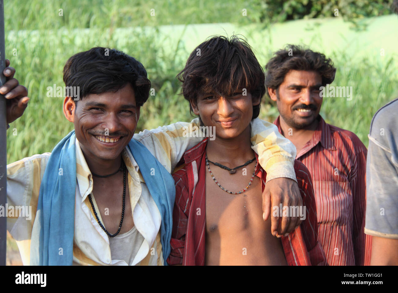 Group of villagers standing together and smiling Stock Photo - Alamy