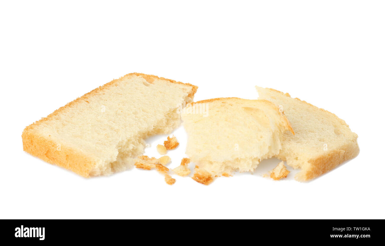 Crumbled pieces of bread isolated on white Stock Photo - Alamy