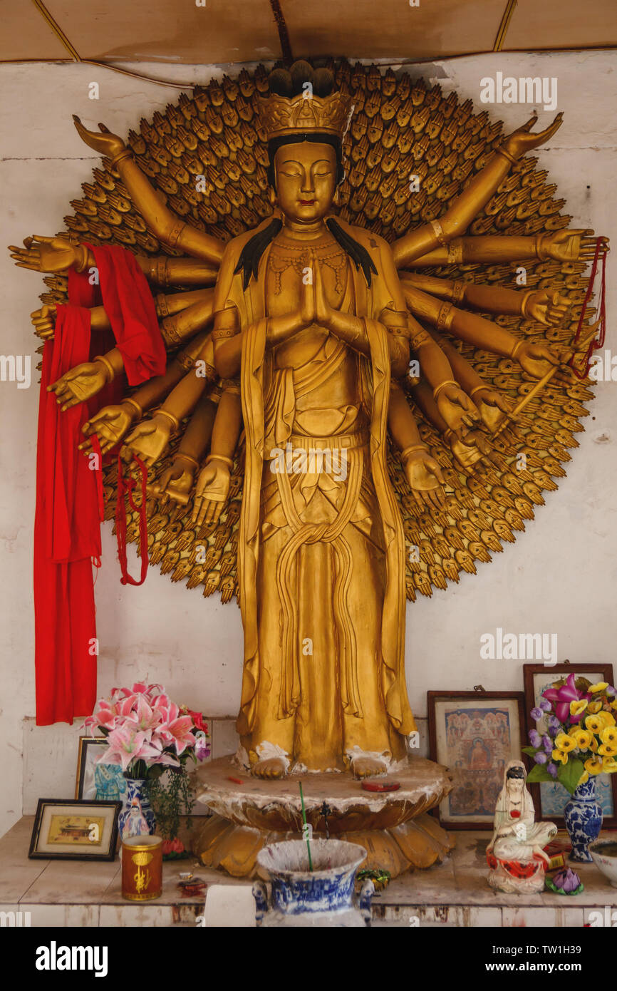 Beautiful Buddhist golden statue in Chinese temple Stock Photo - Alamy