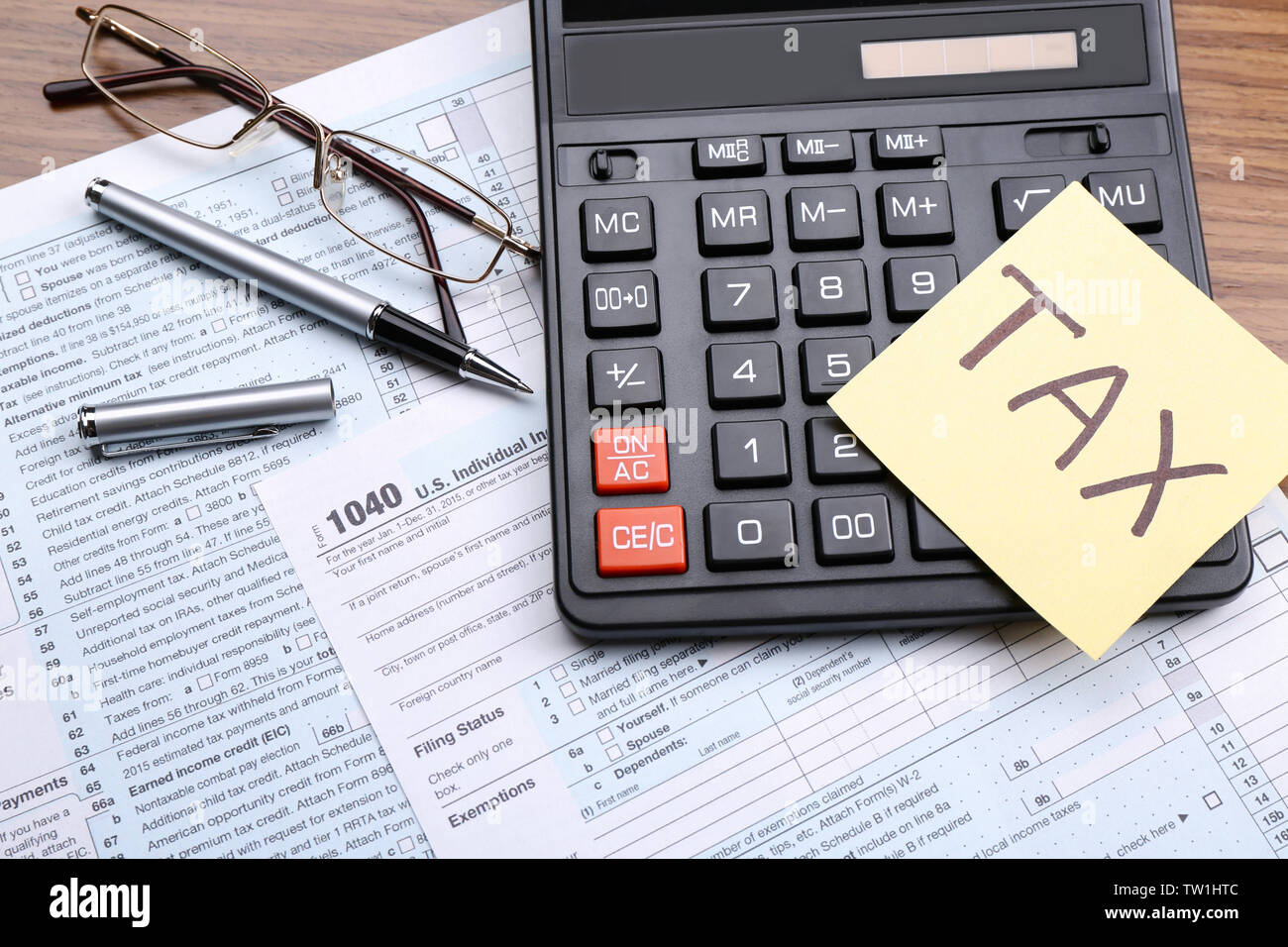 Calculator with documents, closeup. Tax concept Stock Photo - Alamy