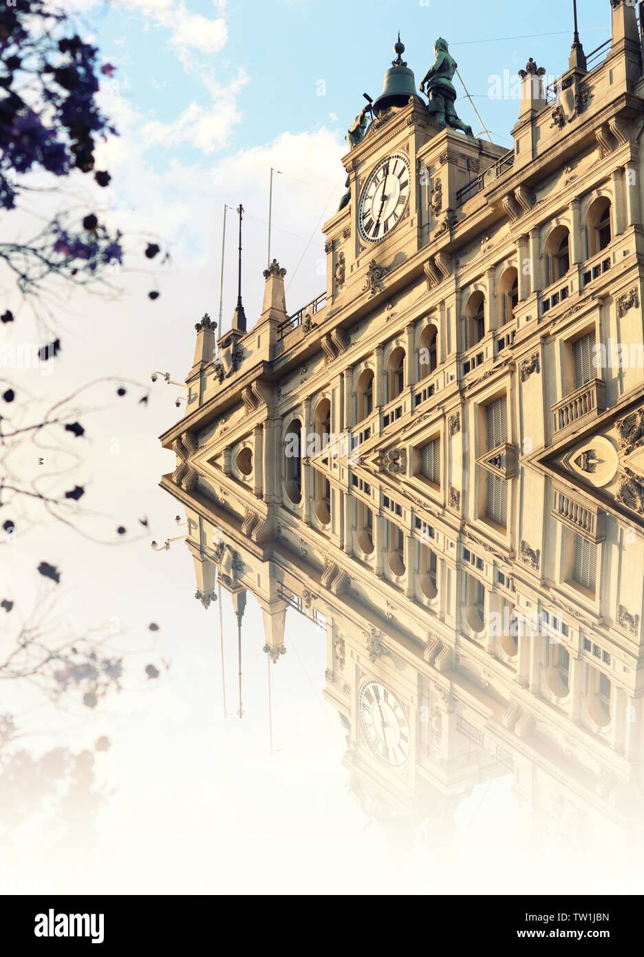 Clock in building with mirror perspective Stock Photo - Alamy