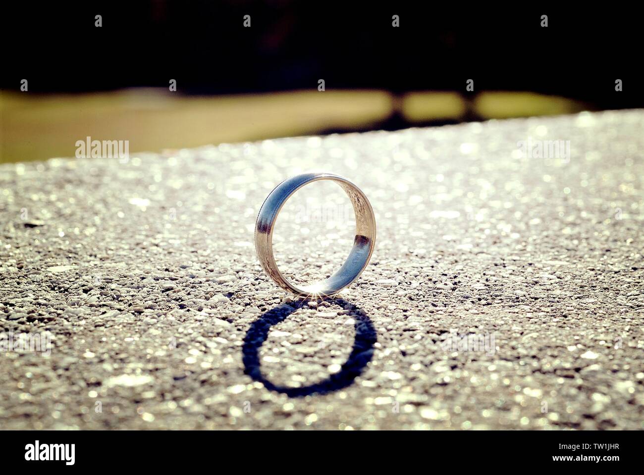 ECLIPSE The shadow of a gold ring is obscurely burnt into the stone ...