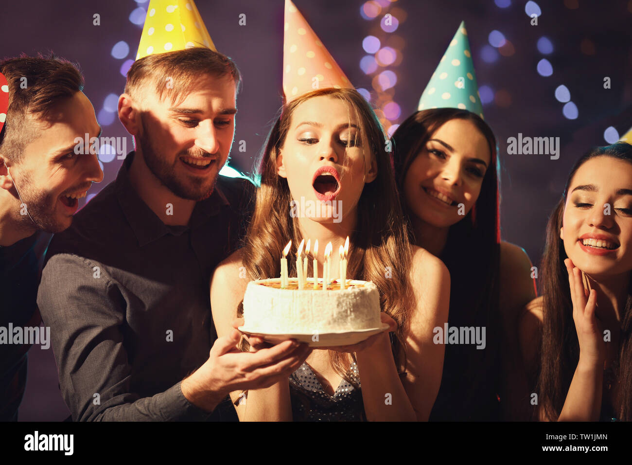 Woman Blowing Out Candles High Resolution Stock Photography and Images ...