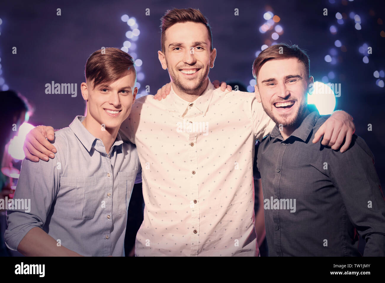 Friends at party in night club Stock Photo - Alamy