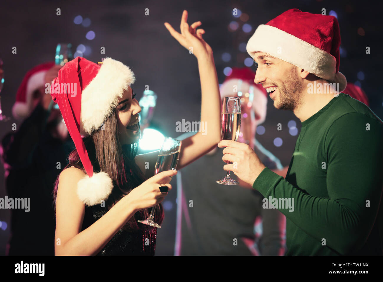 Friends at Christmas party in night club Stock Photo - Alamy