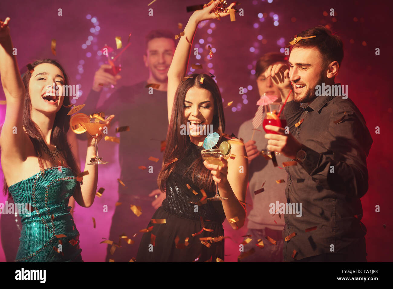Friends having fun at party in night club Stock Photo - Alamy