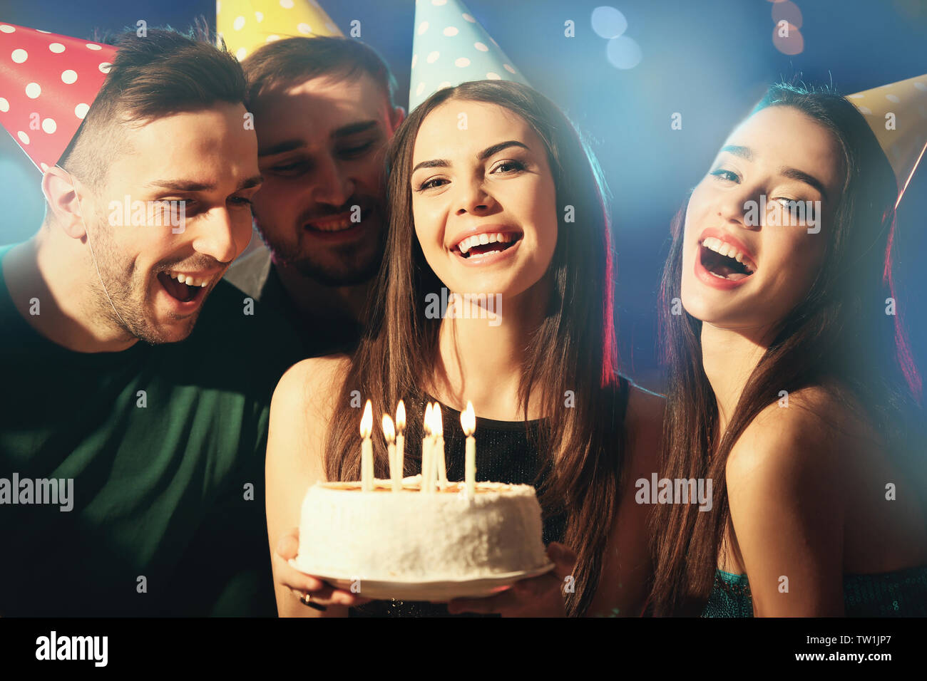 Friends having fun at birthday party in night club Stock Photo - Alamy