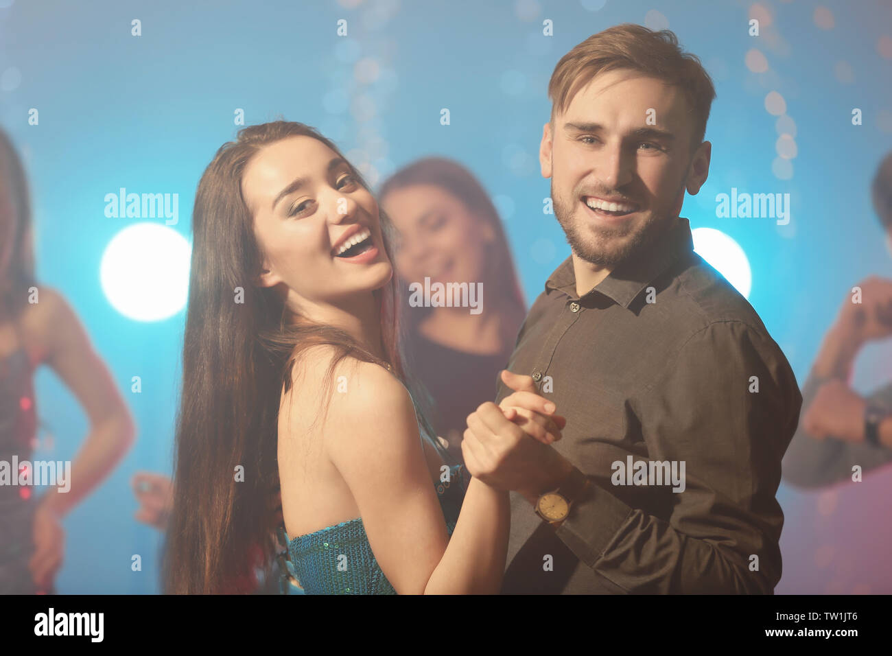 Friends having fun at party in night club Stock Photo - Alamy
