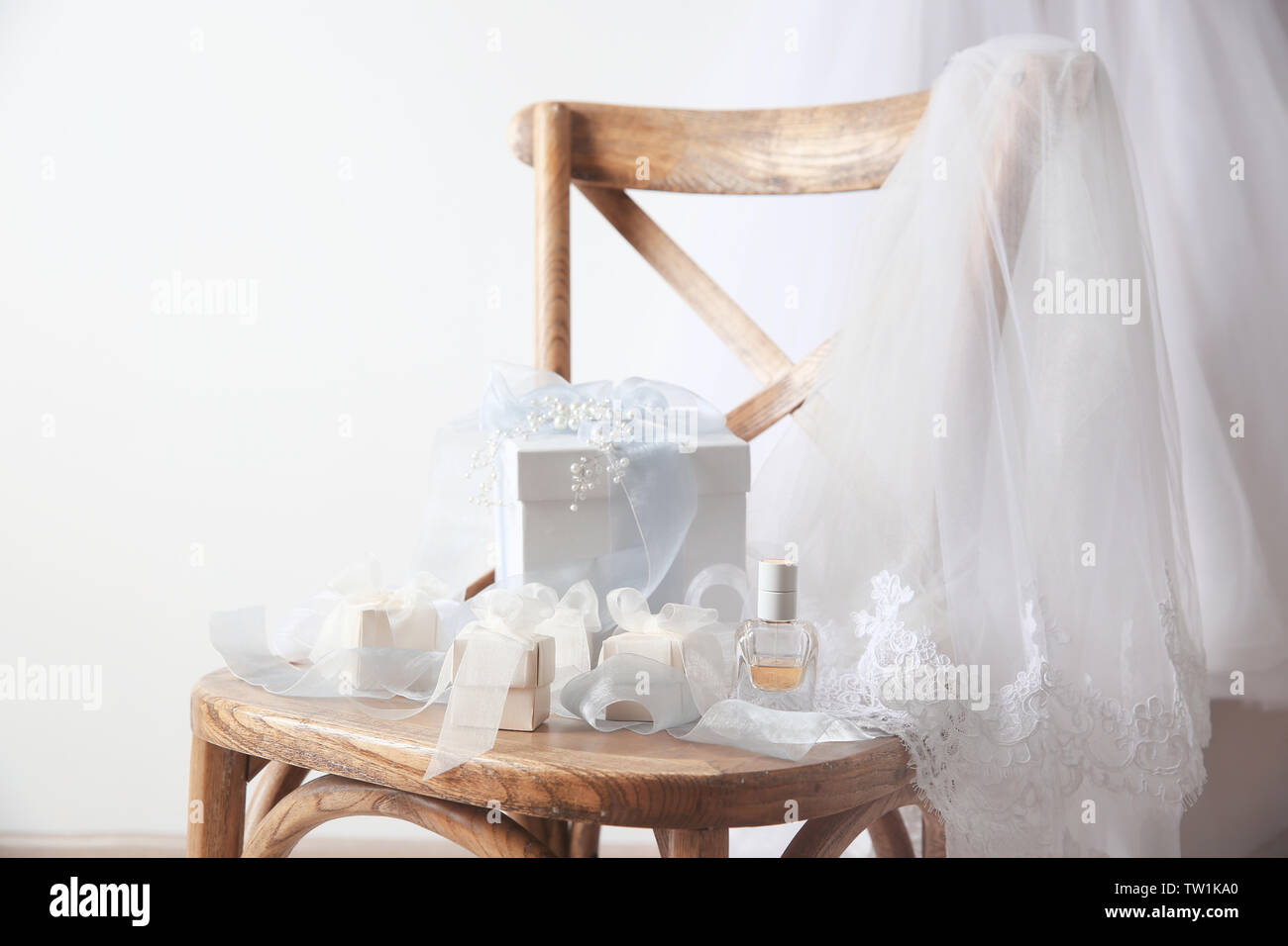 Wooden chair with gift boxes for wedding day Stock Photo - Alamy