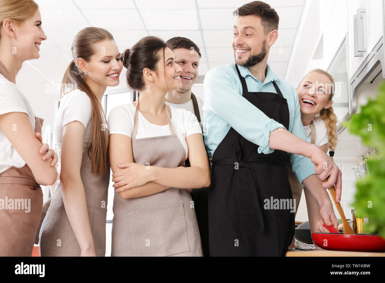 Male chef and group of people at cooking classes Stock Photo - Alamy