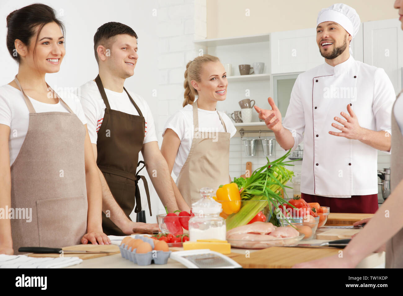 Male chef and group of people at cooking classes Stock Photo - Alamy