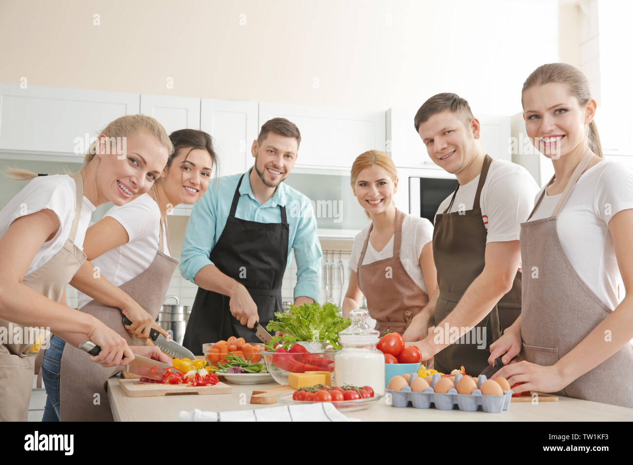Male chef and group of people at cooking classes Stock Photo - Alamy
