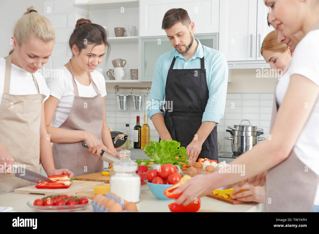Male chef and group of people at cooking classes Stock Photo - Alamy