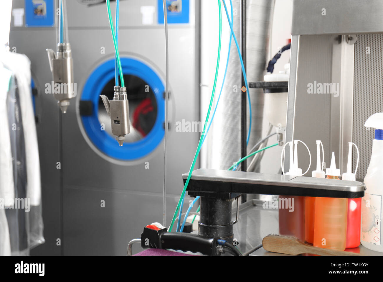 Steam spotting table at dry-cleaning Stock Photo - Alamy
