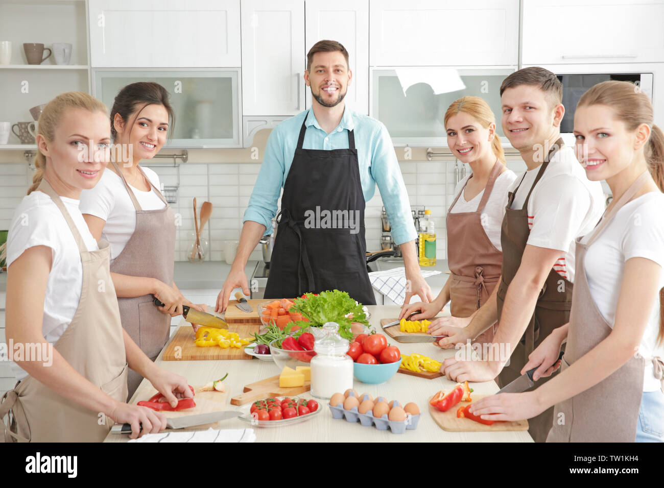 Male chef and group of people at cooking classes Stock Photo - Alamy