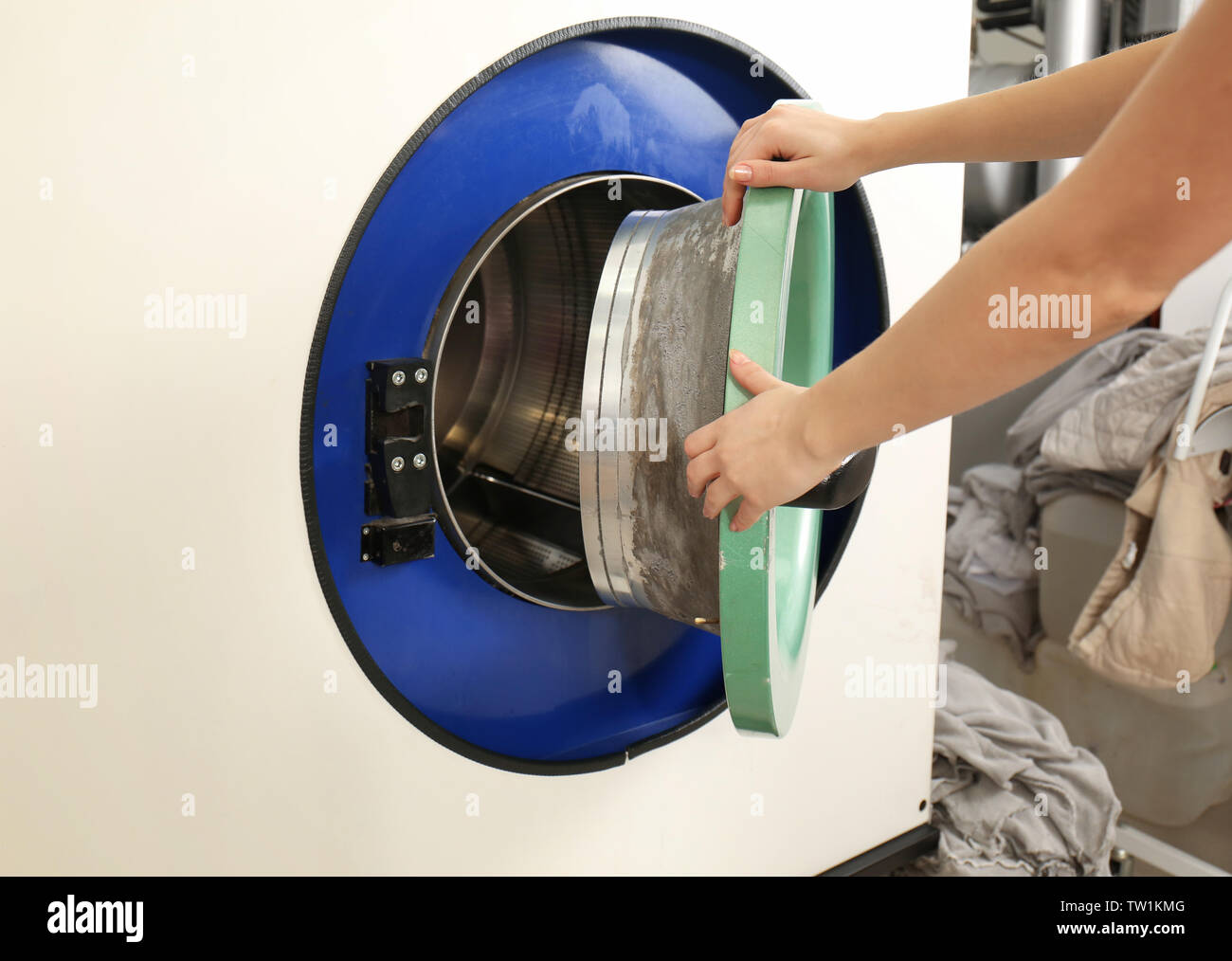 Female hands opening washing machine Stock Photo - Alamy