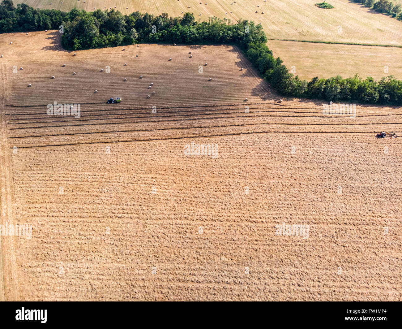 Nature and landscape, aerial view of fields with tractor with round ...