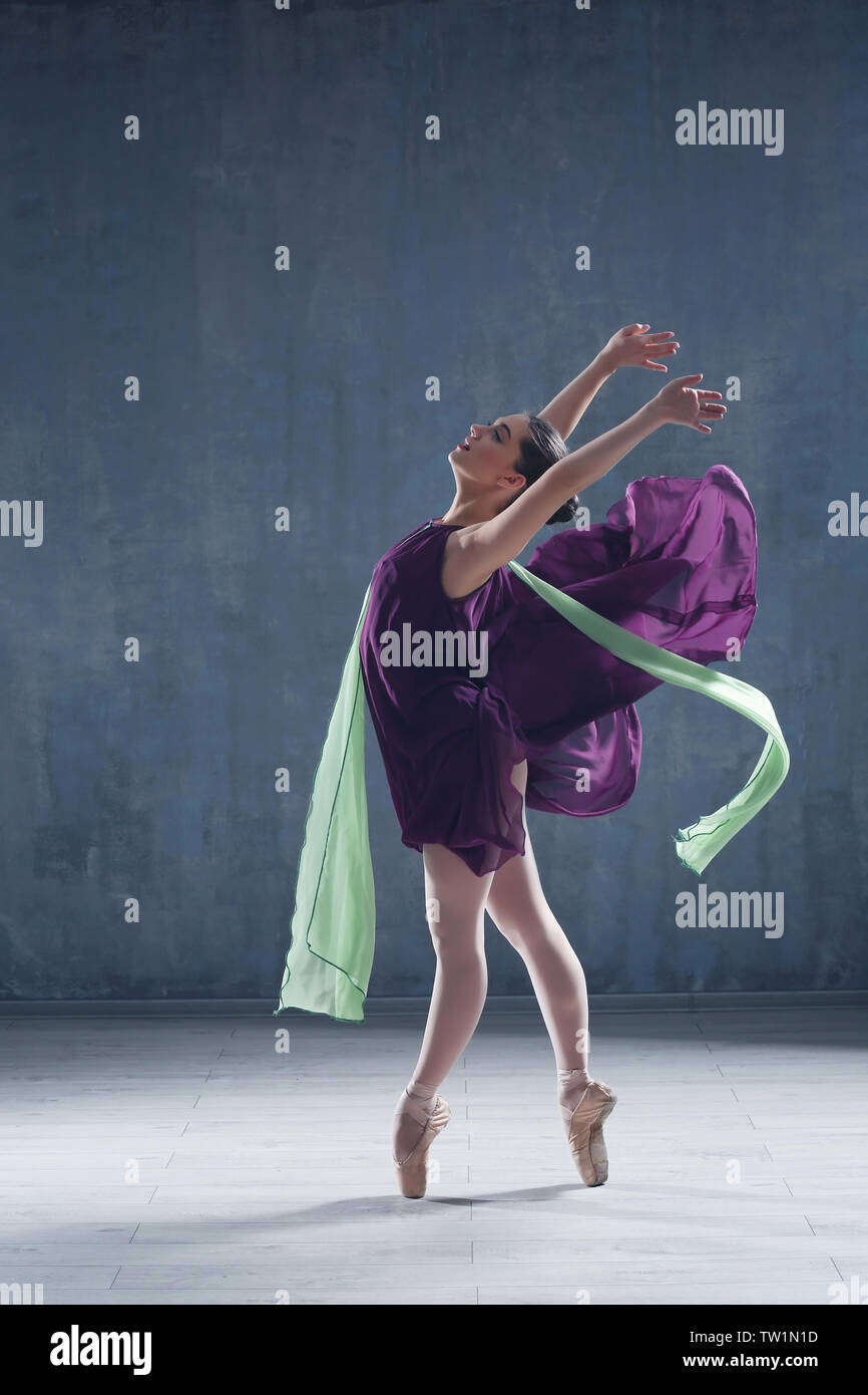 Young beautiful ballerina dancing in studio Stock Photo - Alamy