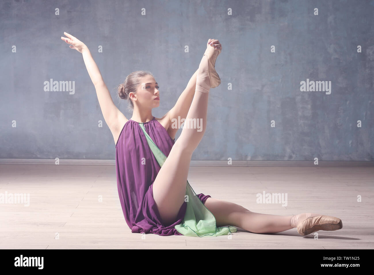 Young beautiful ballerina dancing in studio Stock Photo - Alamy