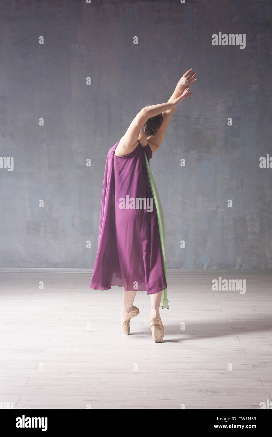 Young beautiful ballerina dancing in studio Stock Photo - Alamy