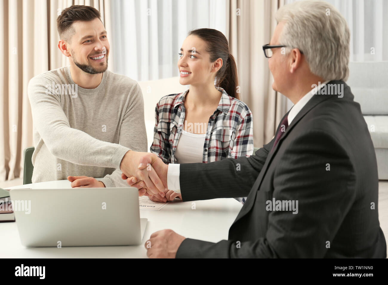 Young couple at notary public office Stock Photo - Alamy