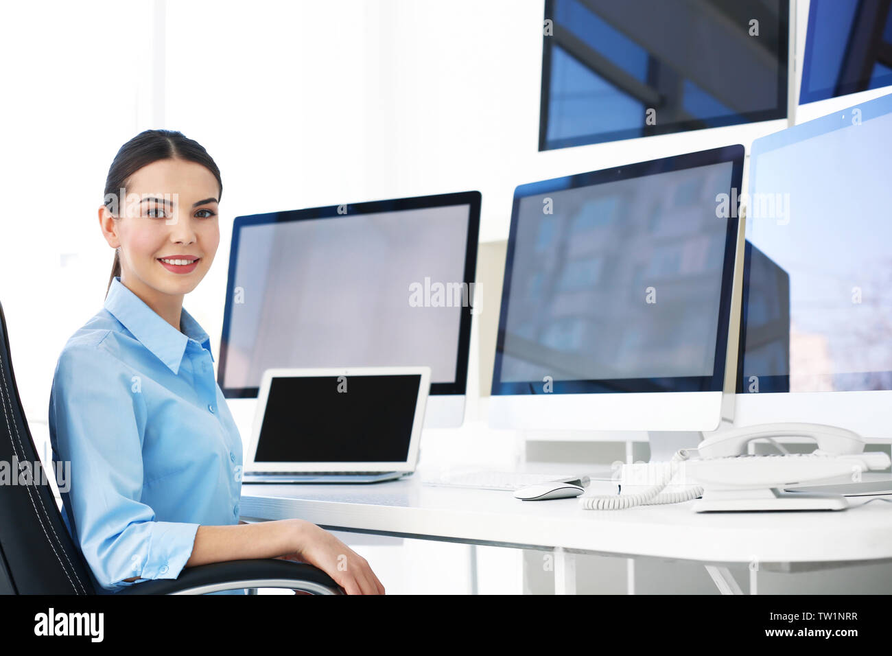 Beautiful security guard in surveillance room Stock Photo - Alamy