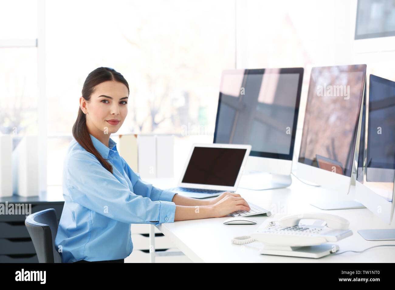 Beautiful security guard in surveillance room Stock Photo - Alamy