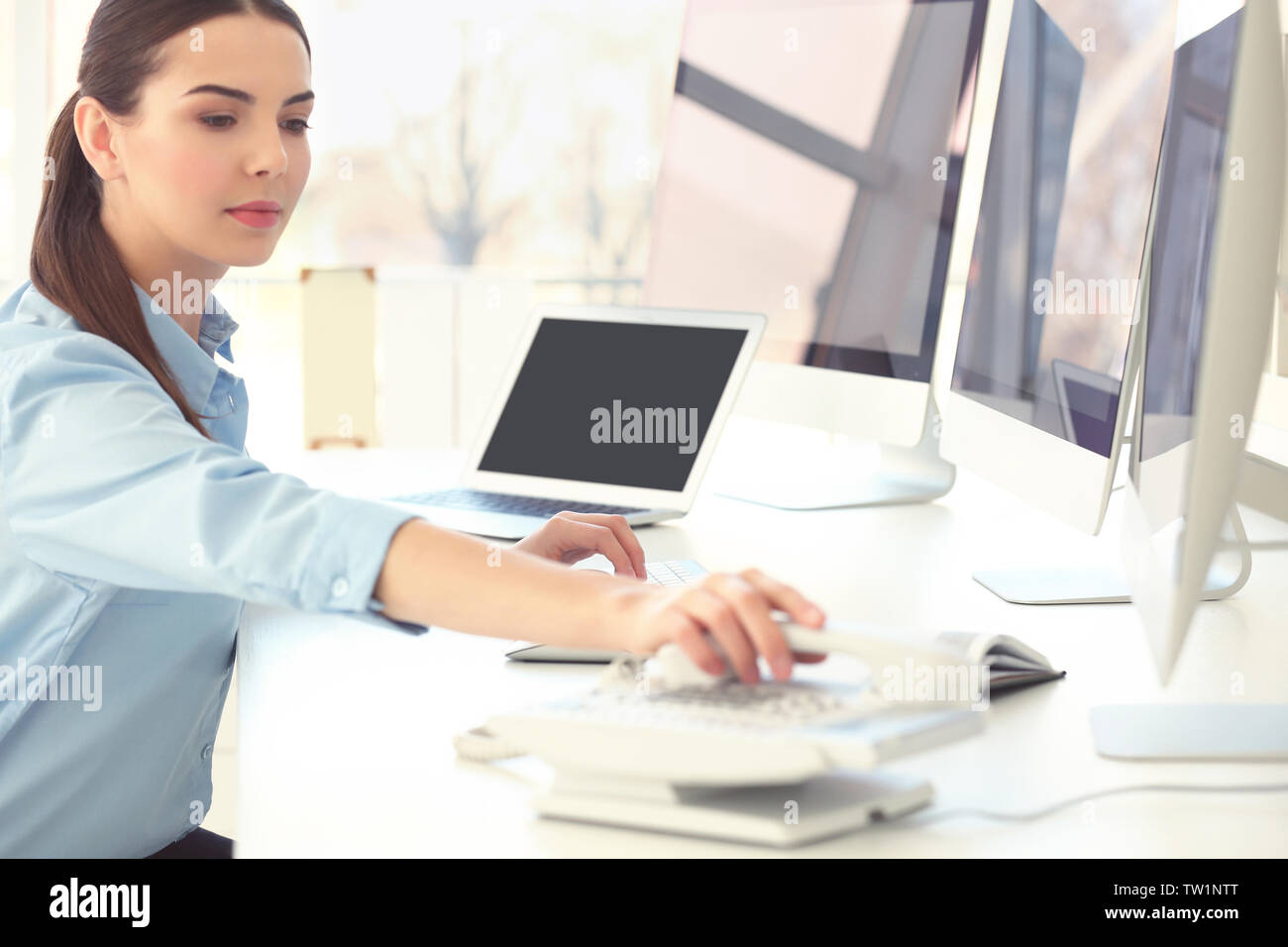 Beautiful security guard in surveillance room Stock Photo - Alamy