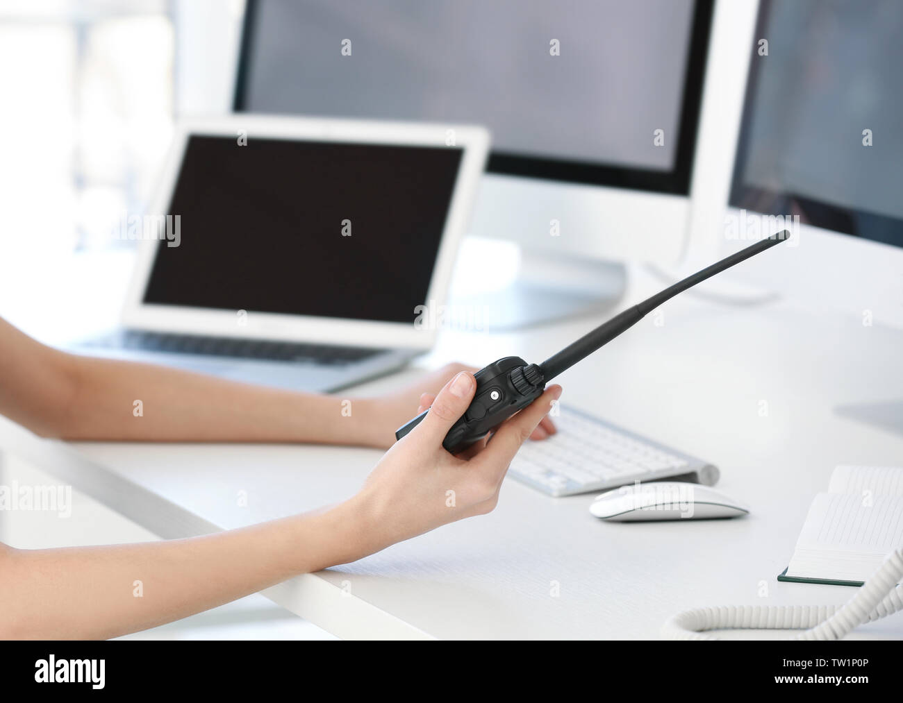 Beautiful security guard in surveillance room Stock Photo - Alamy
