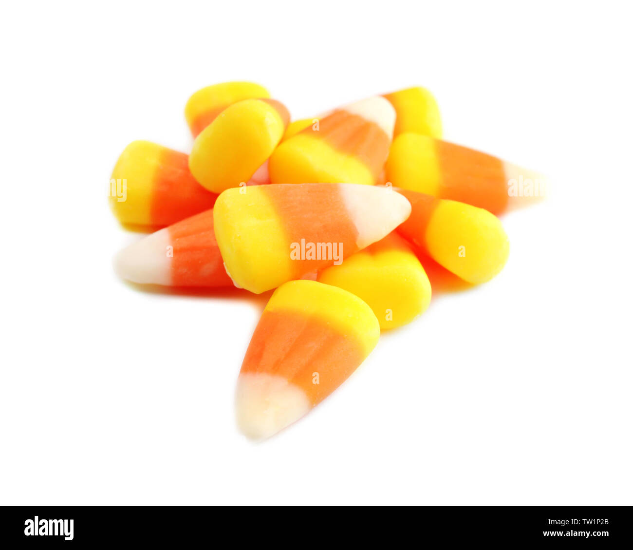 Colorful Halloween candy corns on white background Stock Photo - Alamy