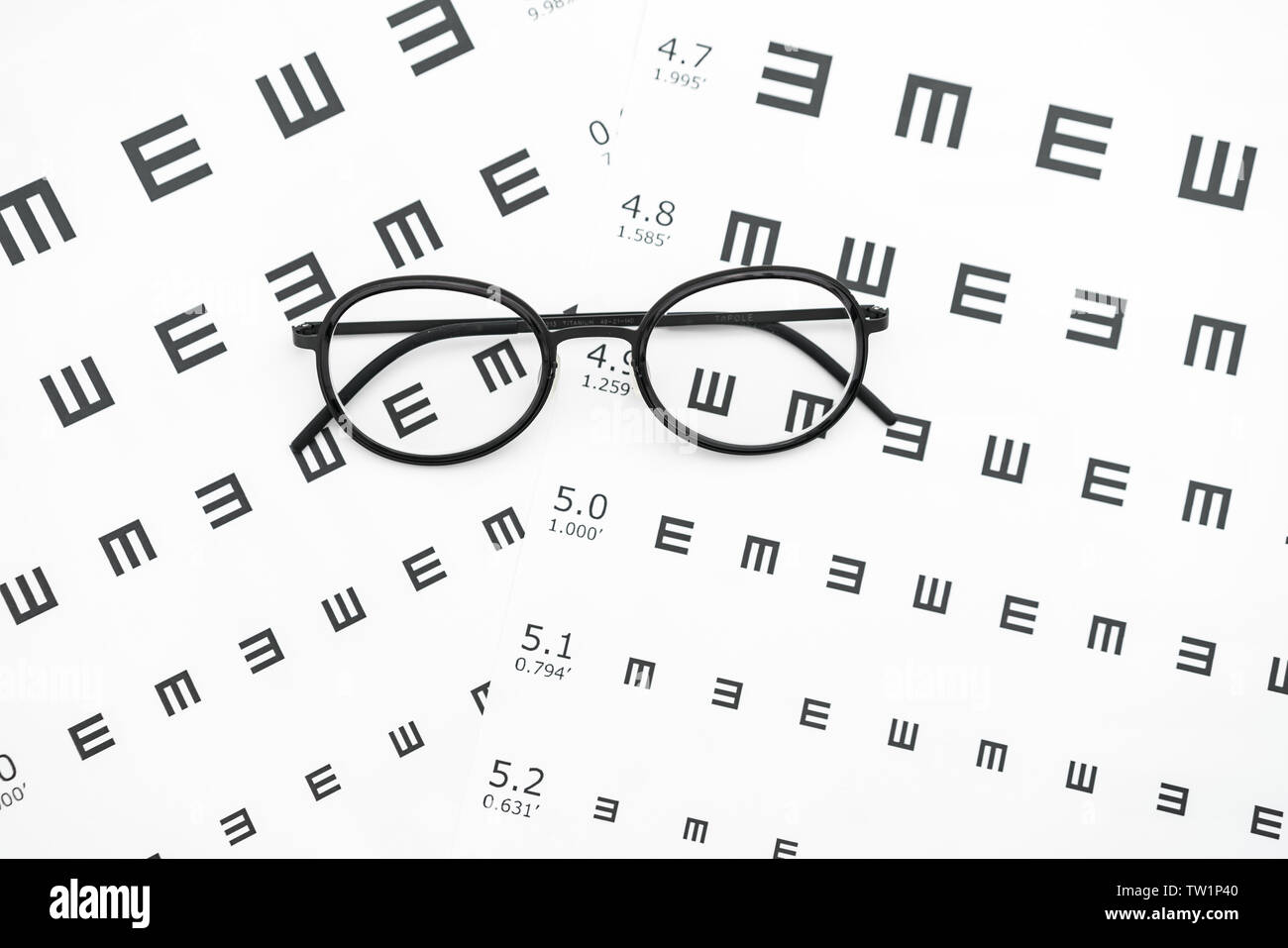 Black glasses and visual meter on white background Stock Photo - Alamy