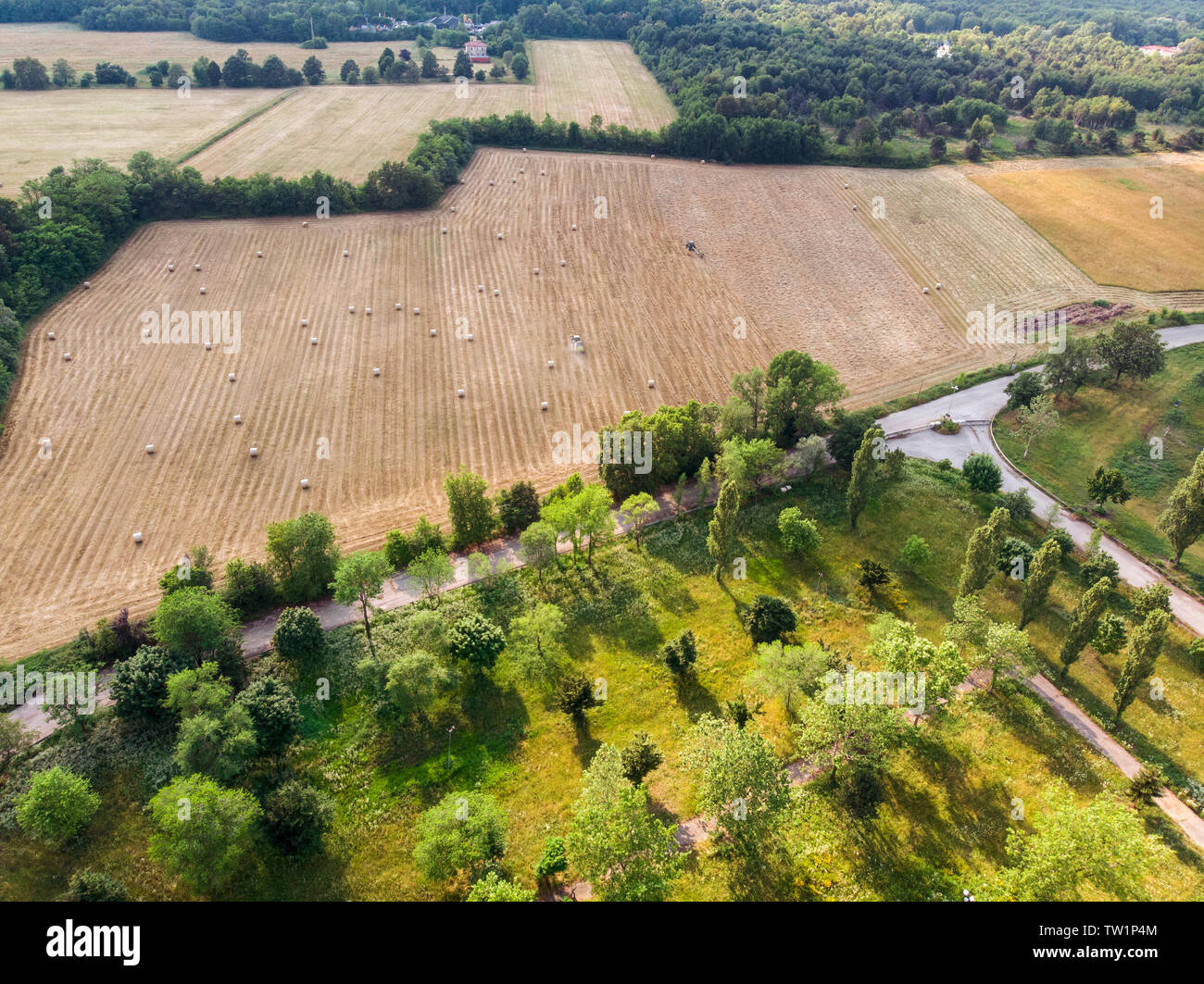 Nature and landscape, aerial view of fields with tractor with round ...