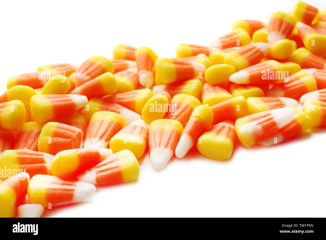 Colorful Halloween candy corns on white background Stock Photo - Alamy