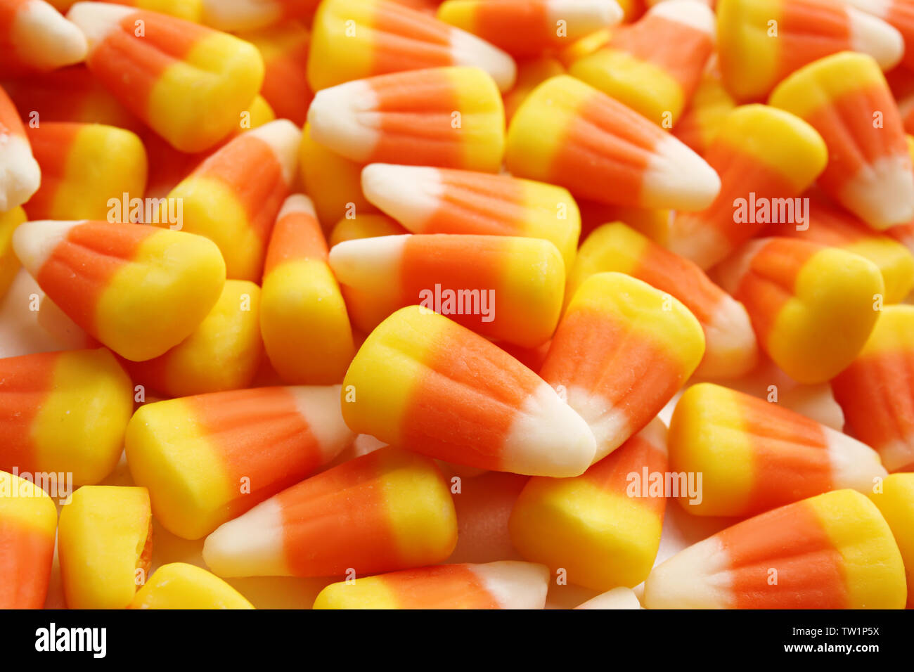 Colorful Halloween candy corns background Stock Photo - Alamy