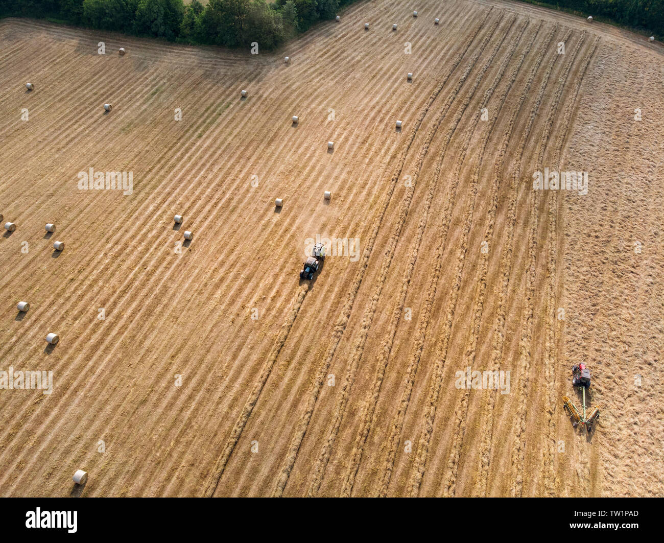 Nature and landscape, aerial view of fields with tractor with round ...