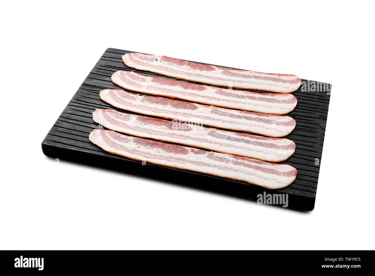 Wooden board with strips of bacon on white background Stock Photo - Alamy