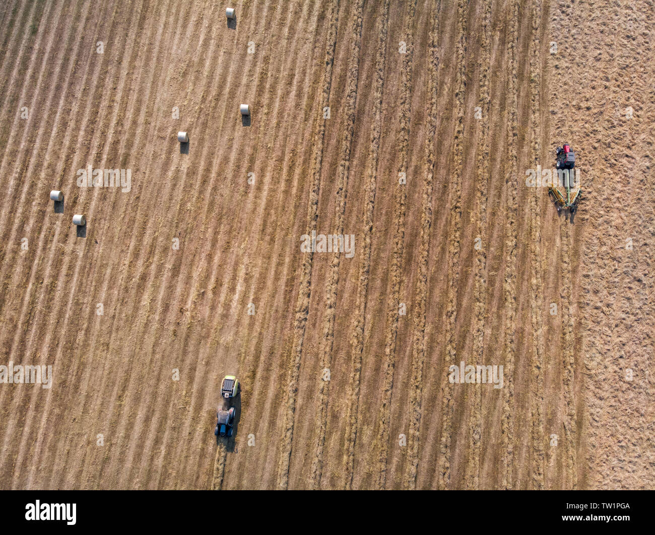 Nature and landscape, aerial view of fields with tractor with round ...
