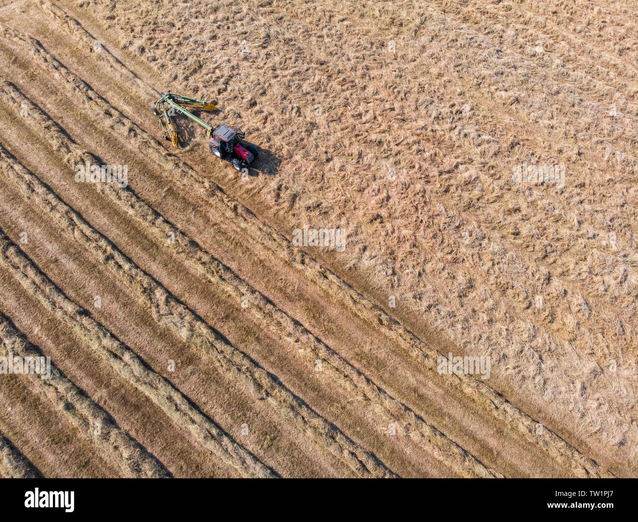 Nature and landscape, aerial view of fields with tractor with round ...