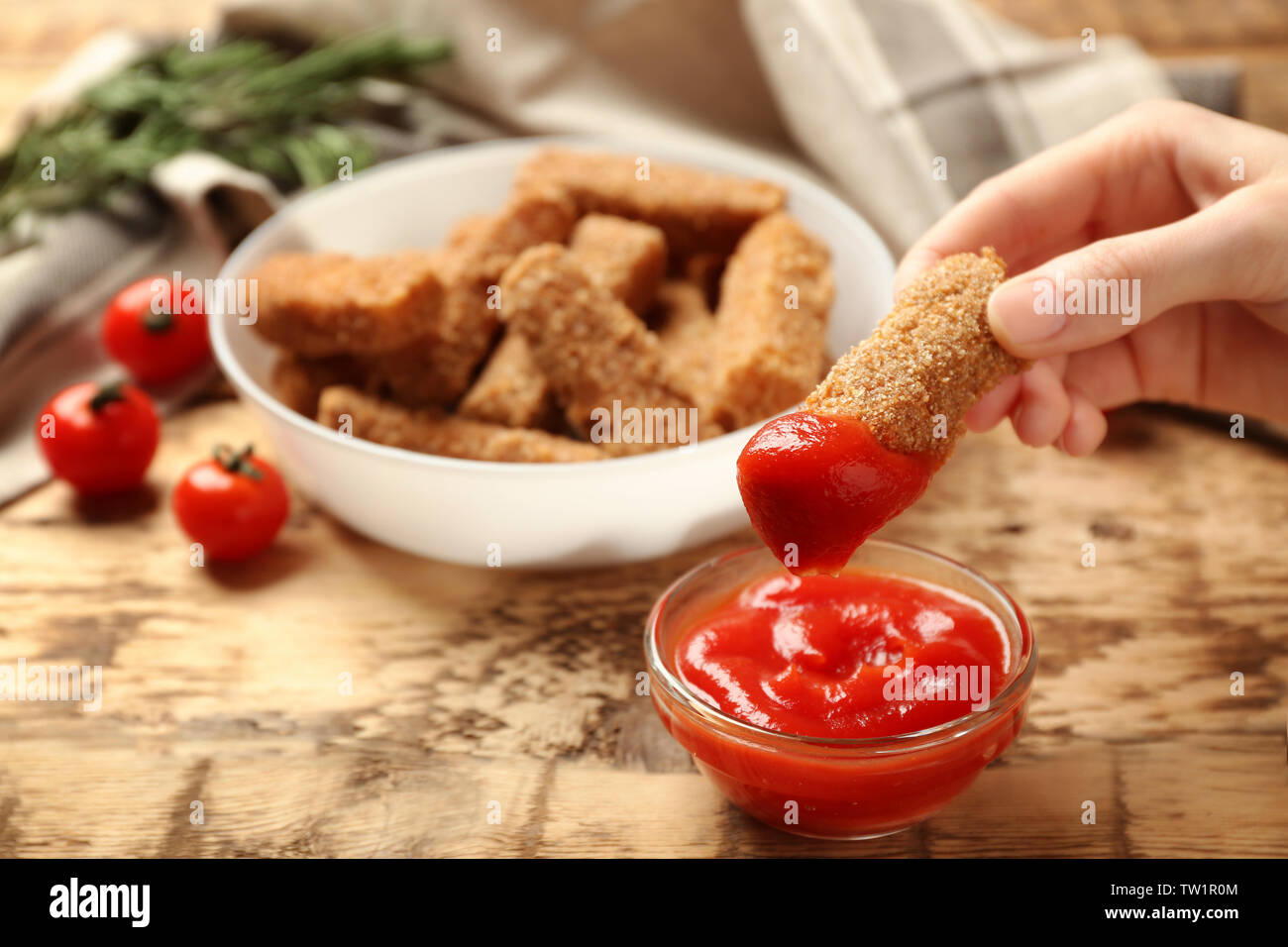 Female hand holding cheese stick with ketchup, closeup Stock Photo - Alamy