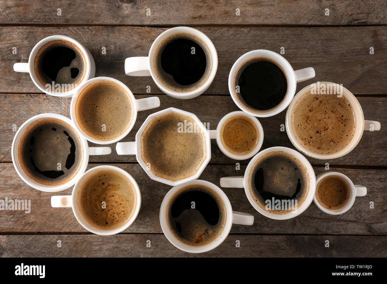 Lots of coffee cups on wooden background Stock Photo - Alamy