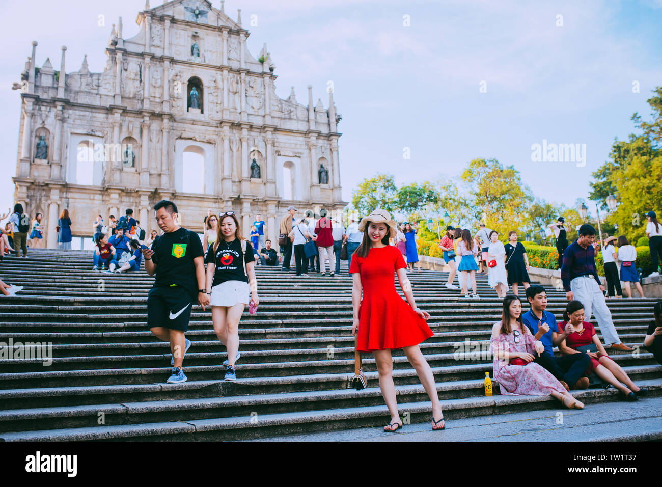 Red dress tour the big three buses Stock Photo - Alamy