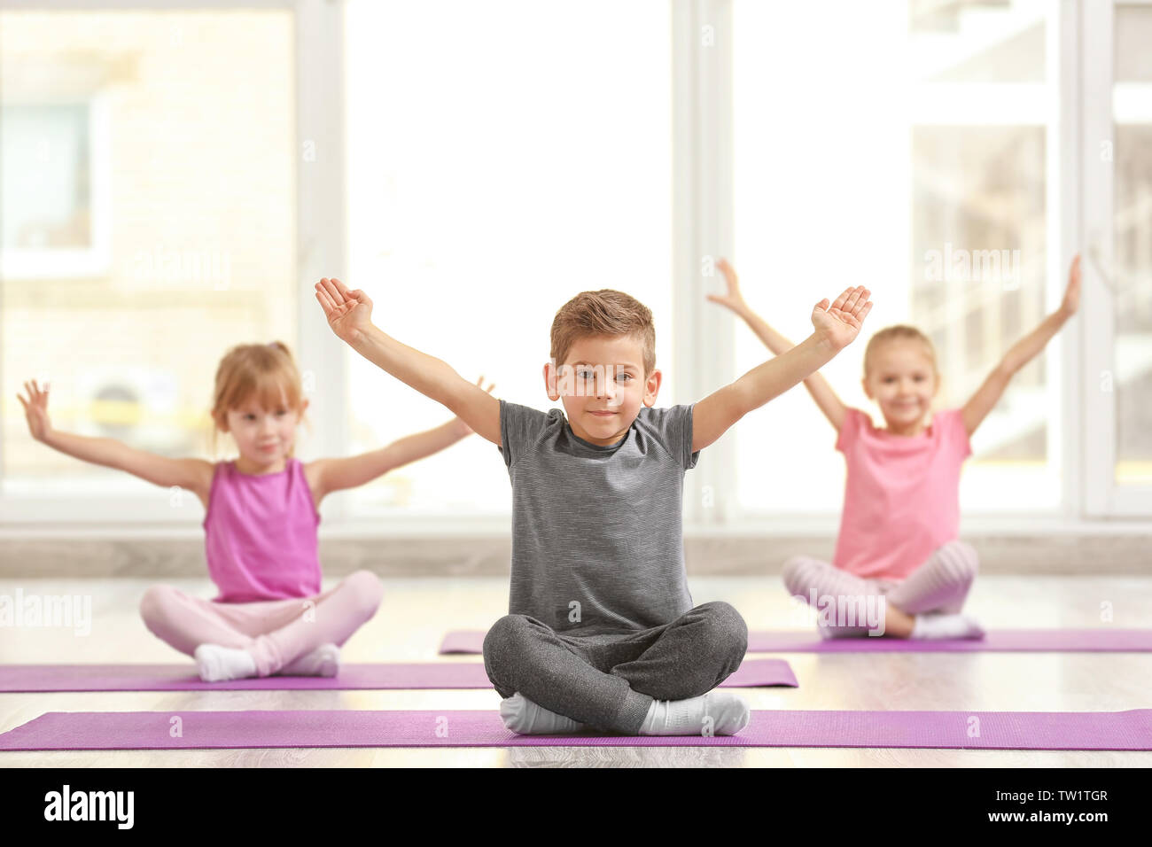 Group of children doing gymnastic exercises Stock Photo - Alamy