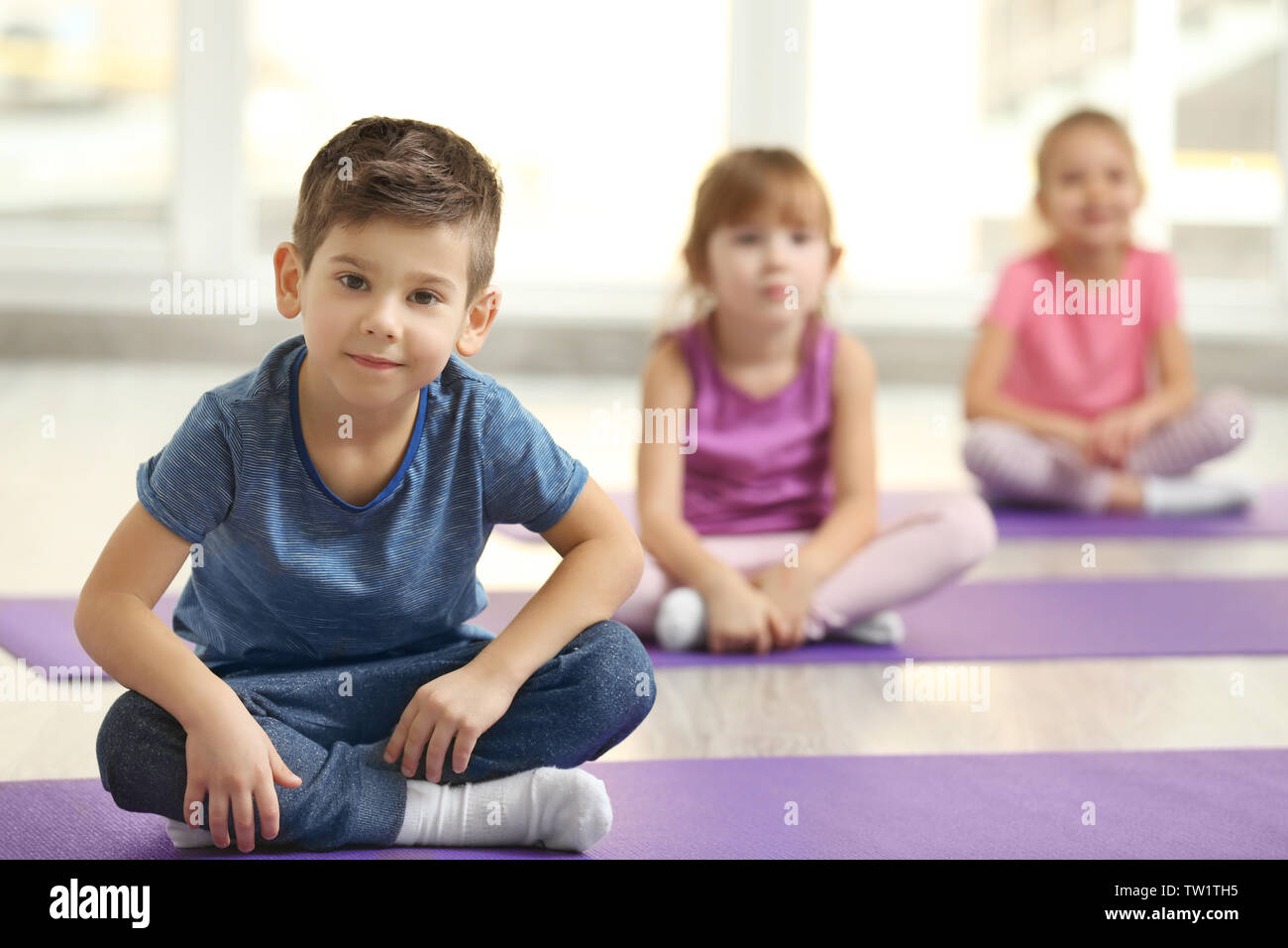 Group of children doing gymnastic exercises Stock Photo - Alamy